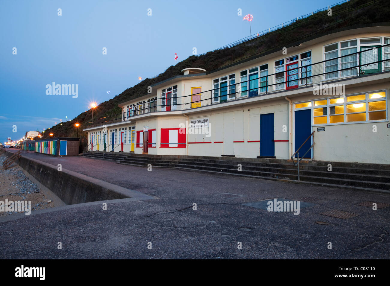 Beach huts and café on Cromer sea front at night Norfolk East Anglia ...