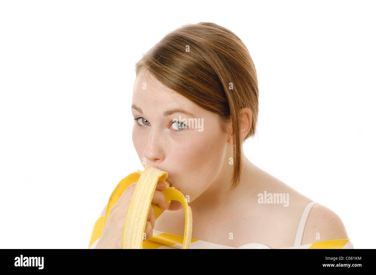 Healthy eating, girl eating fruit Stock Photo - Alamy