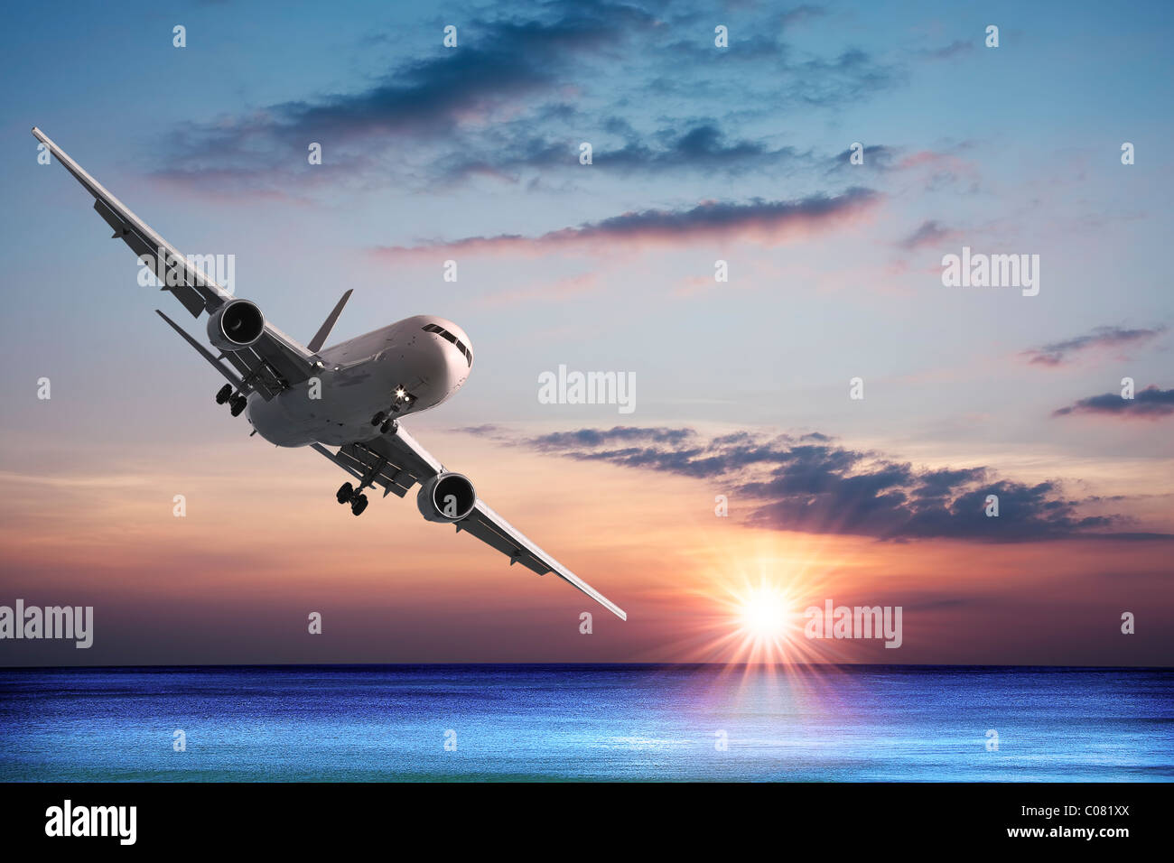 Jet aircraft over the sea Stock Photo - Alamy