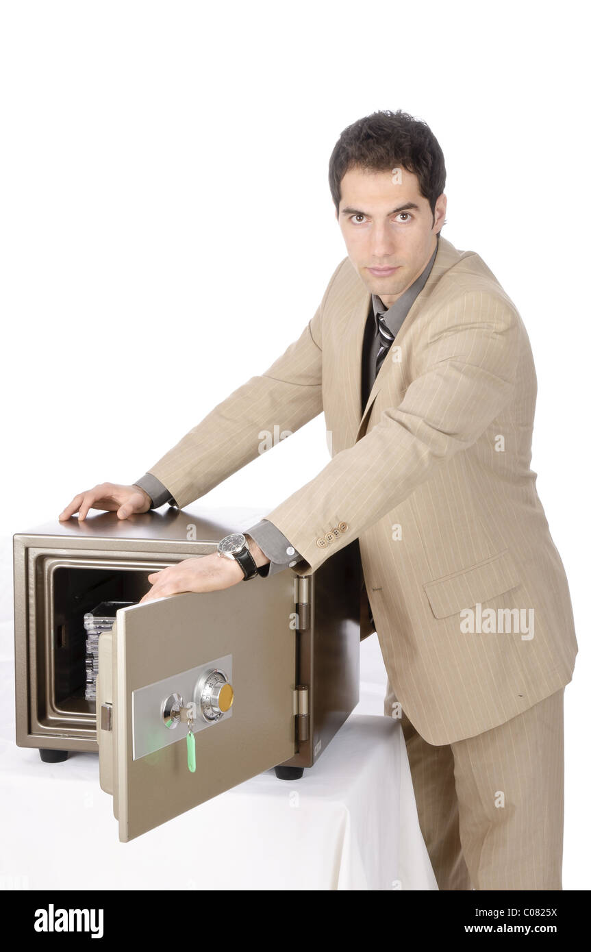 Businessman with a safe Stock Photo - Alamy
