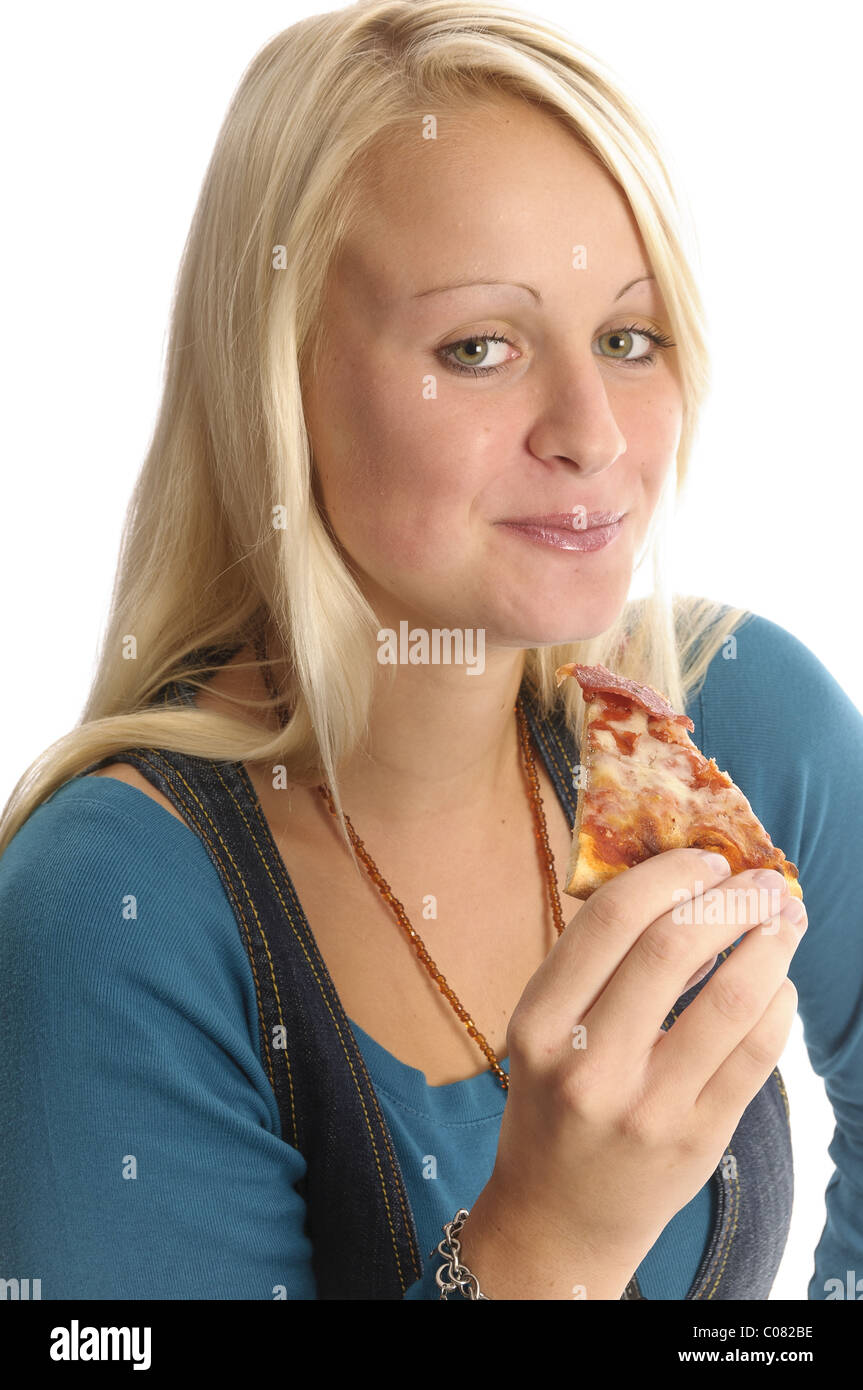 Woman eating a pizza slice Stock Photo - Alamy