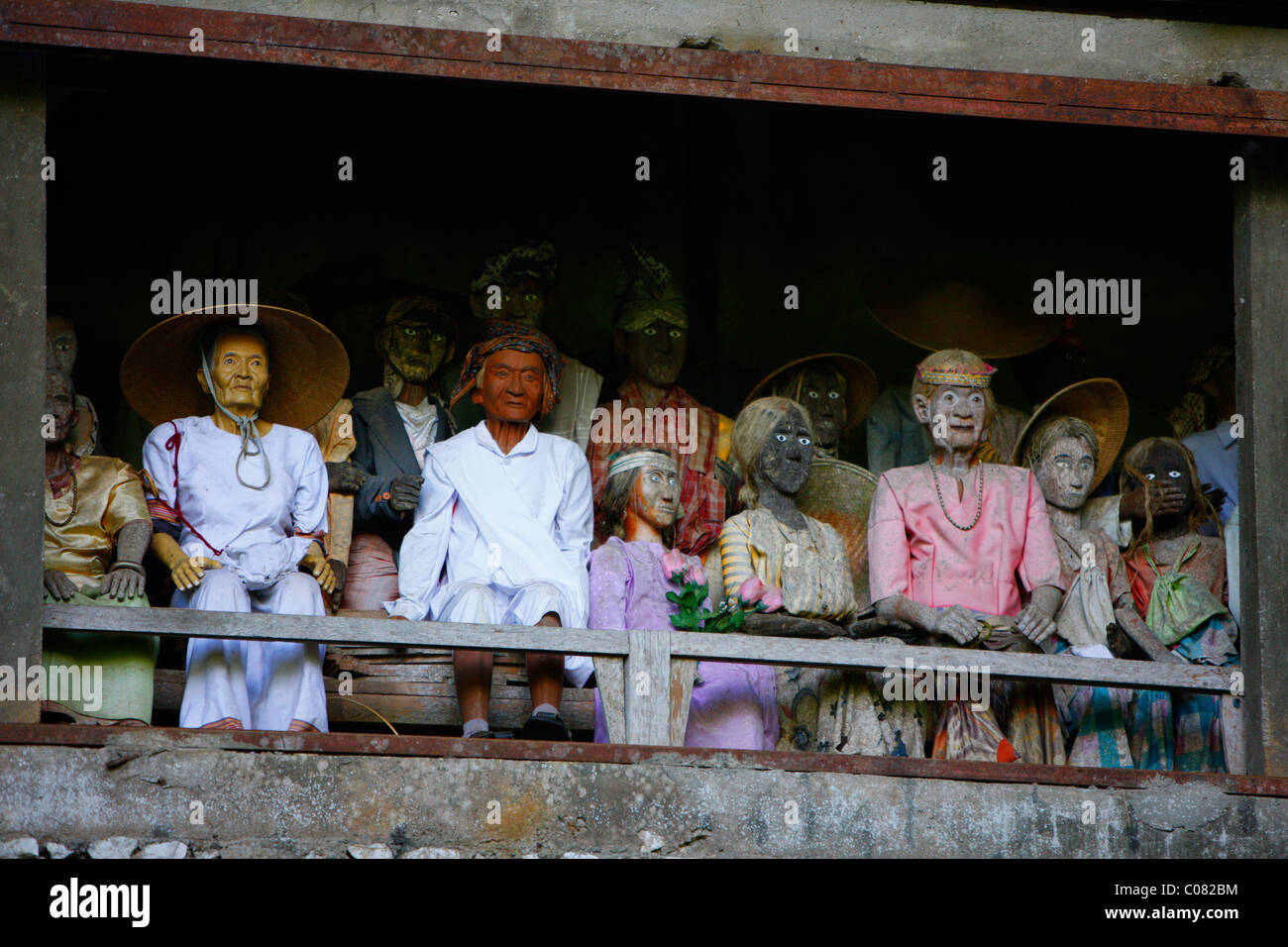 Figures in a rock tomb, Londa, Toraja culture, Sulawesi, Indonesia ...