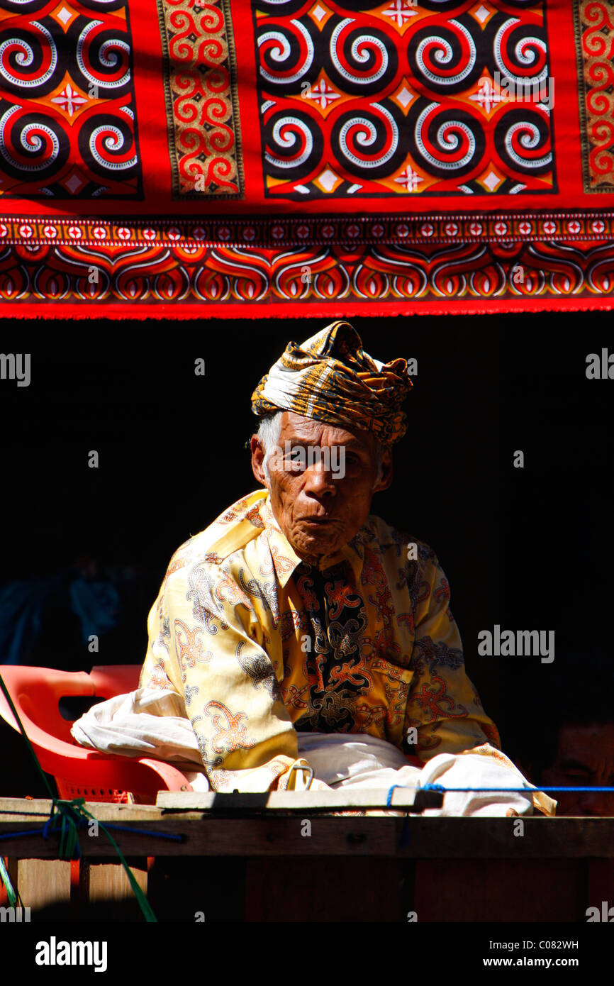 Village elder during burial ceremony, Toraja culture, Sulawesi ...