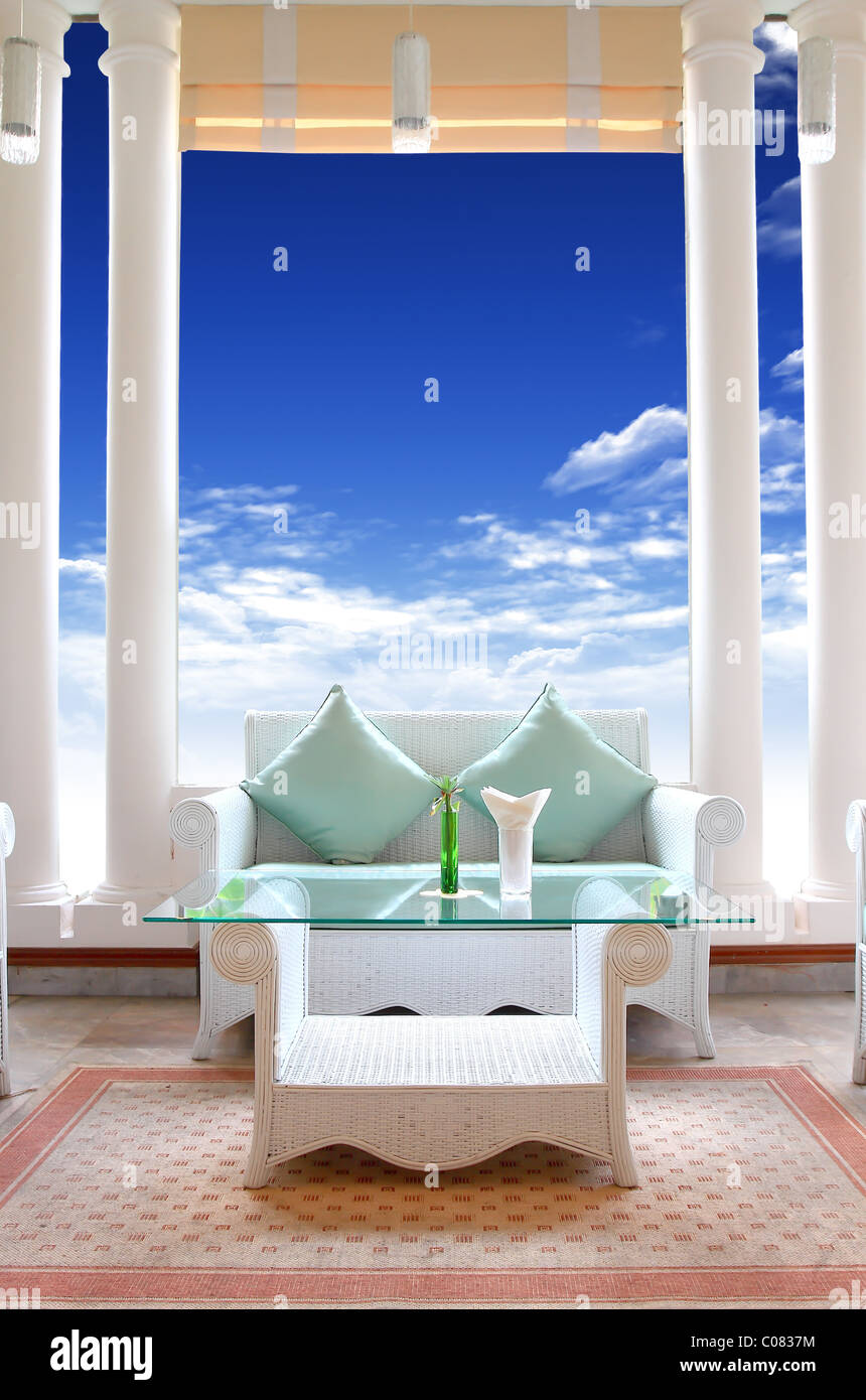 Armchairs and a table on an open terrace Stock Photo - Alamy