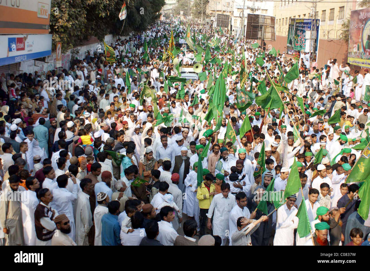 Participants of Eid-Milad-un-Nabi (SAW) rally pass through a road in ...