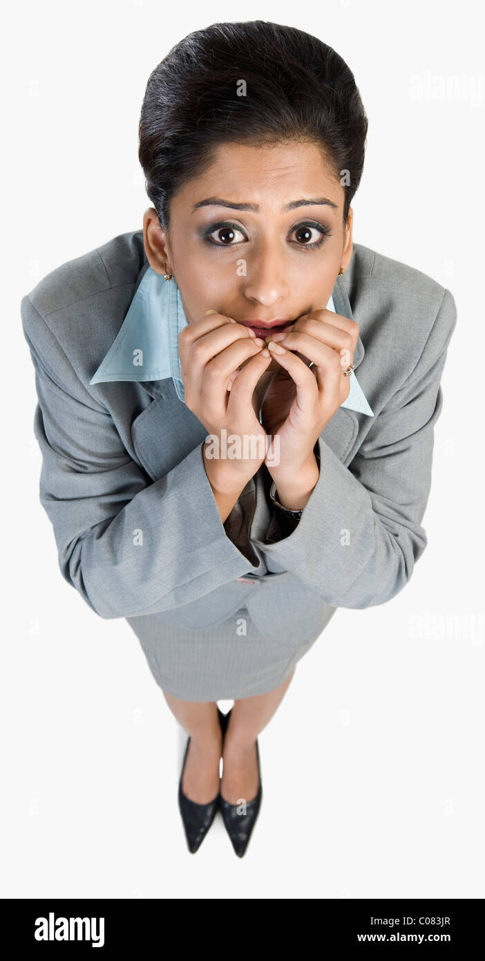 Businesswoman looking terrified Stock Photo - Alamy