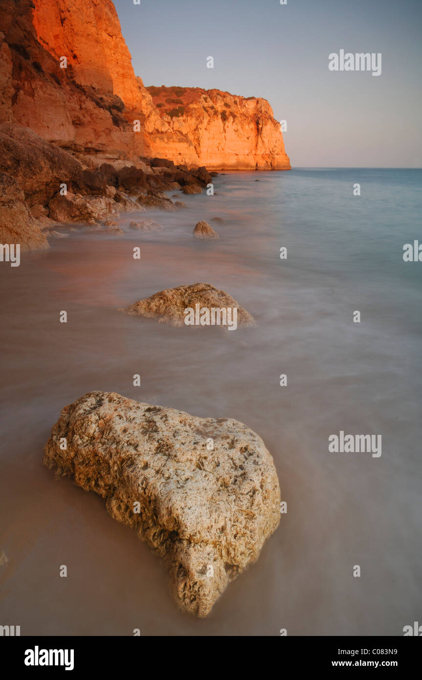 Sunset on the beach in Lagos, Algarve, Portugal, Europe Stock Photo - Alamy