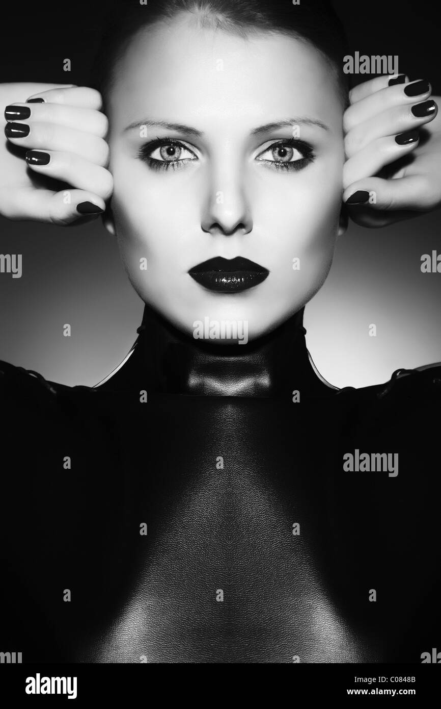 Woman hands on head black top Black and White Stock Photos & Images - Alamy
