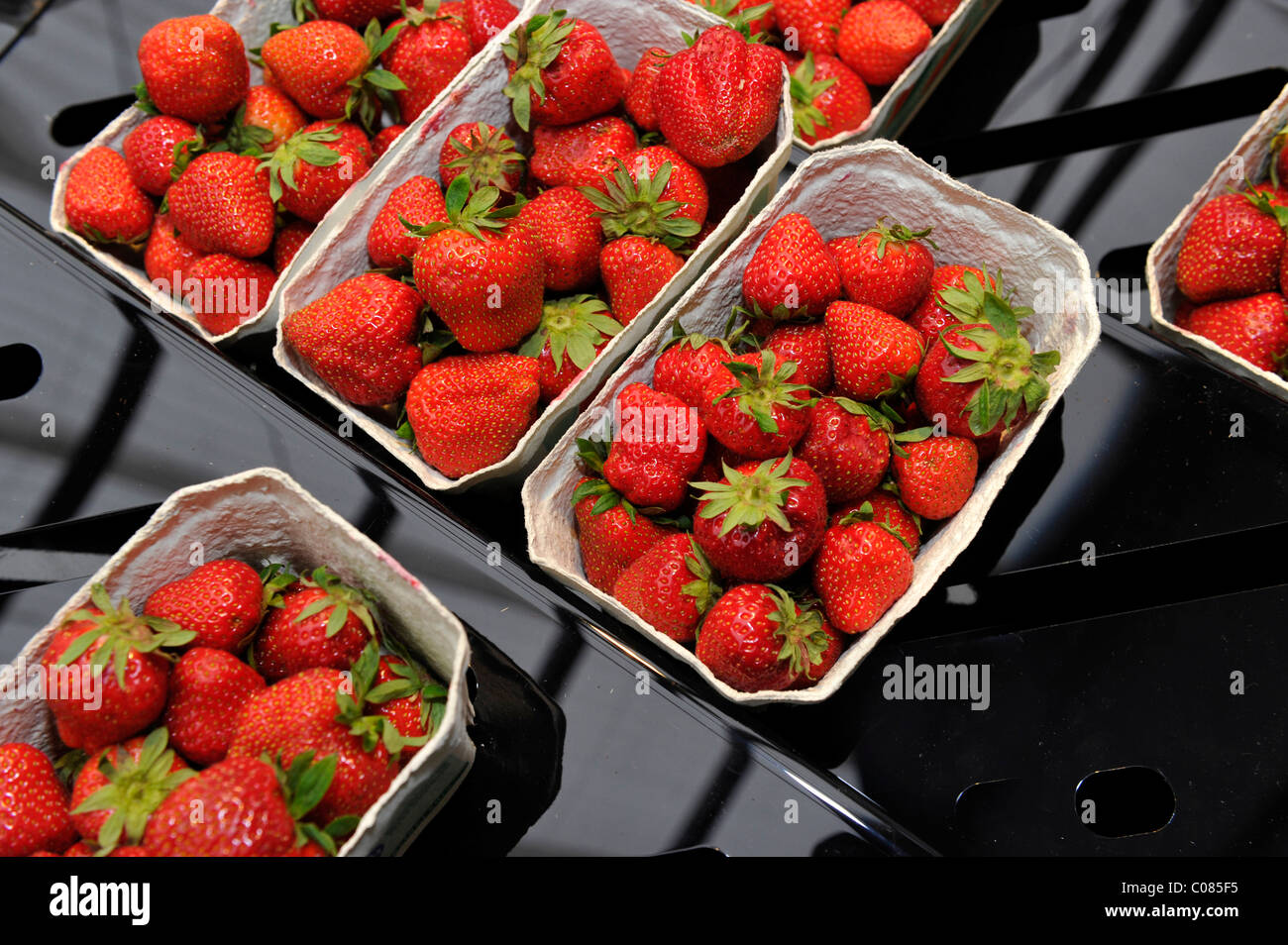Colourful display of strawberries hi-res stock photography and images ...
