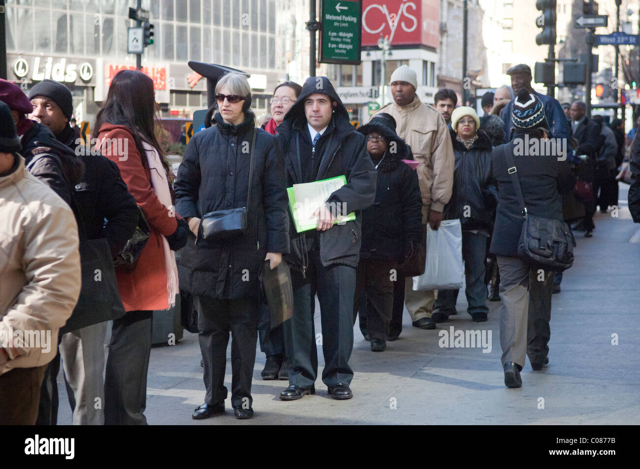 Job seekers line up for a job fair in midtown in New York on Tuesday ...
