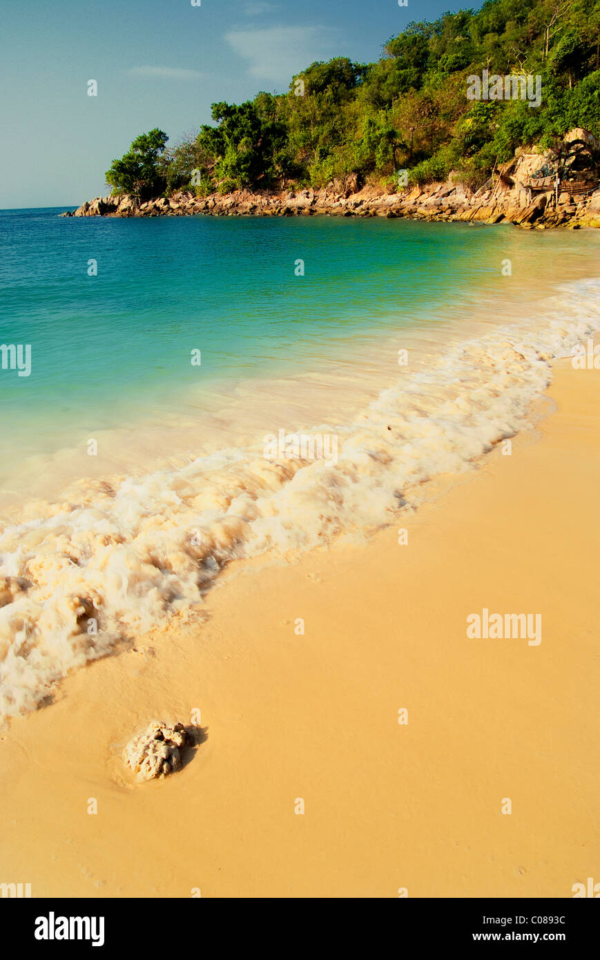 Beach with sand. Calm blue water Stock Photo - Alamy