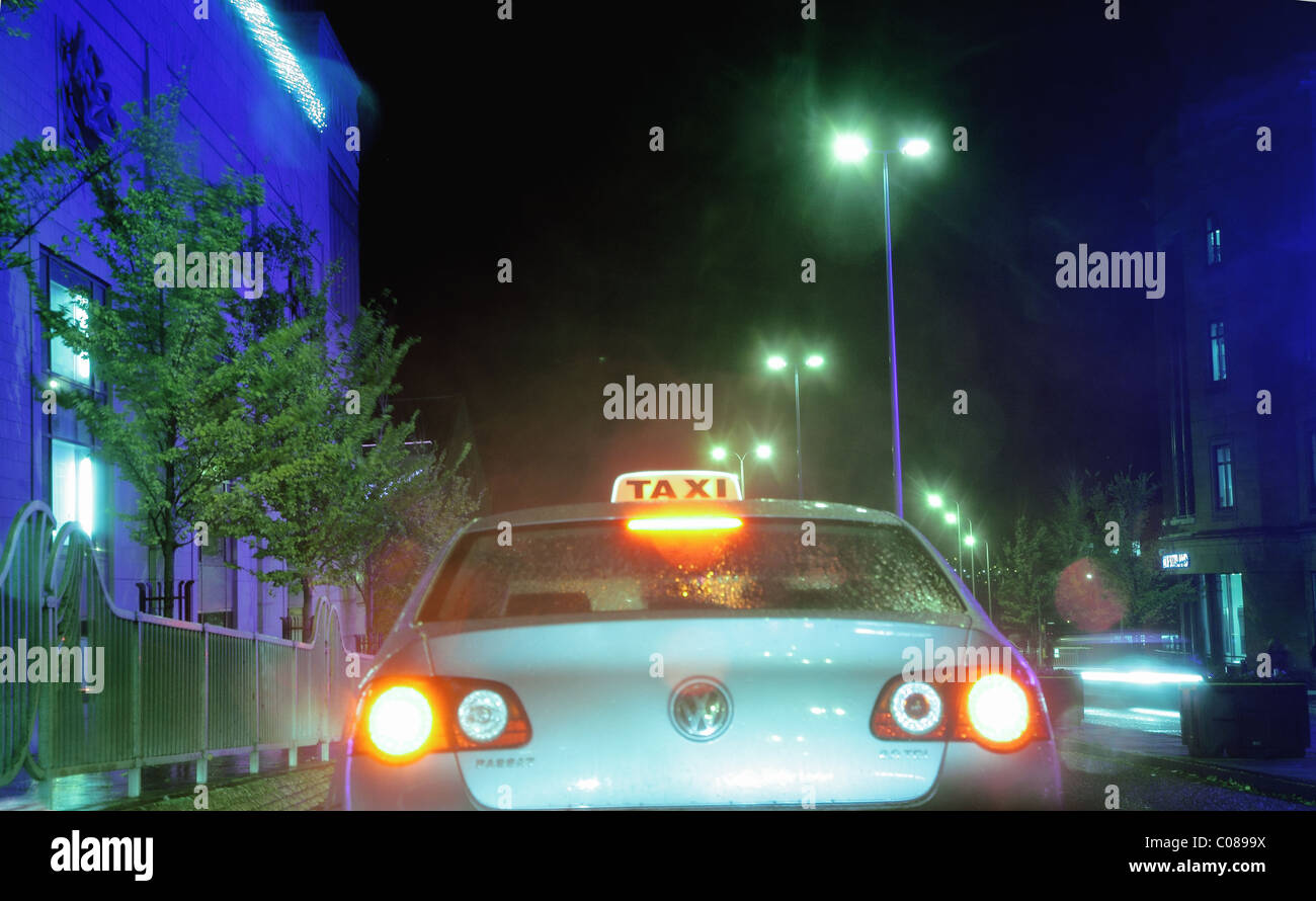 Taxi Driving in city centre Dundee Stock Photo - Alamy
