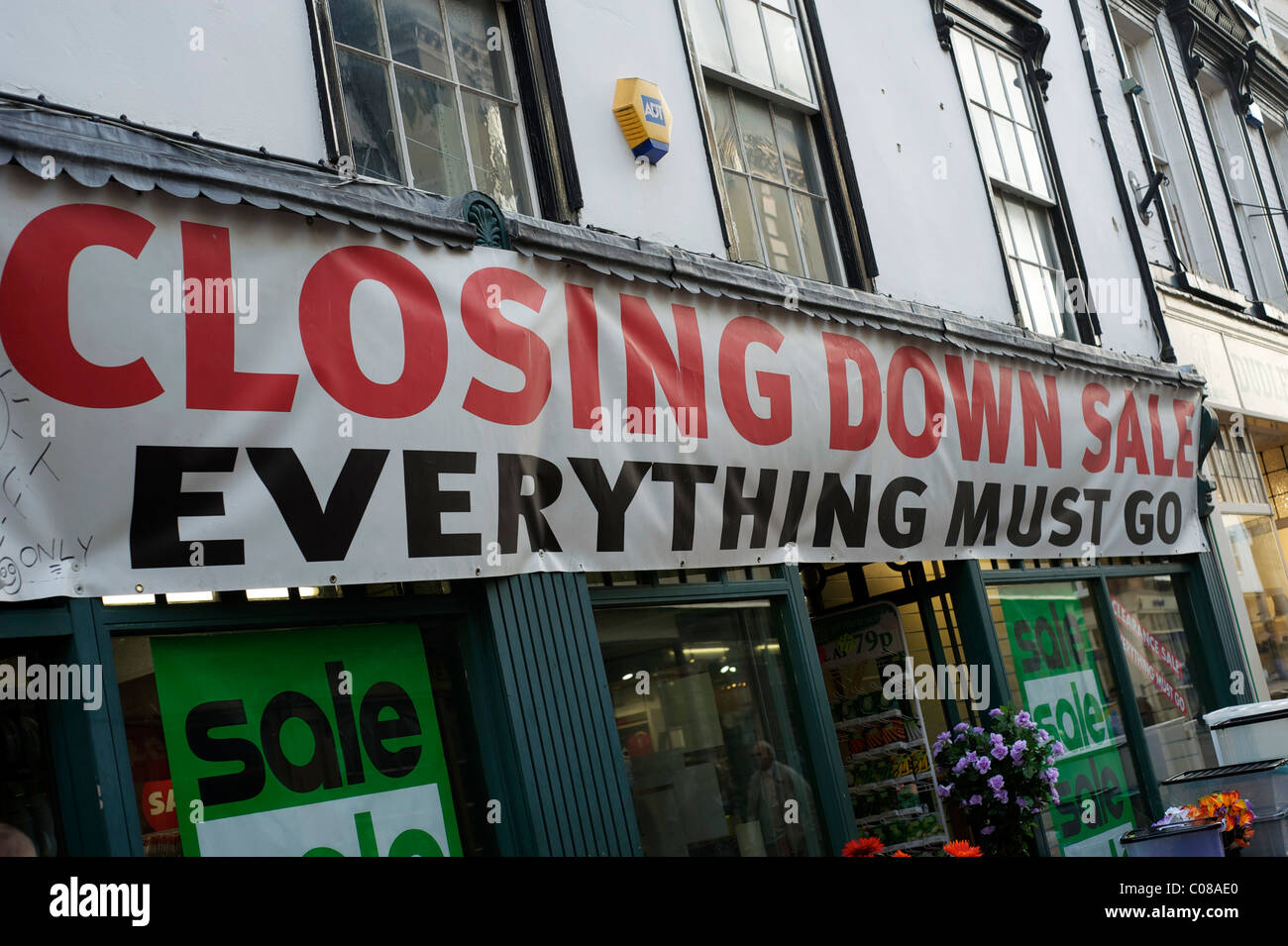 Advertising hoarding above a shop which say Closing Down Sale ...