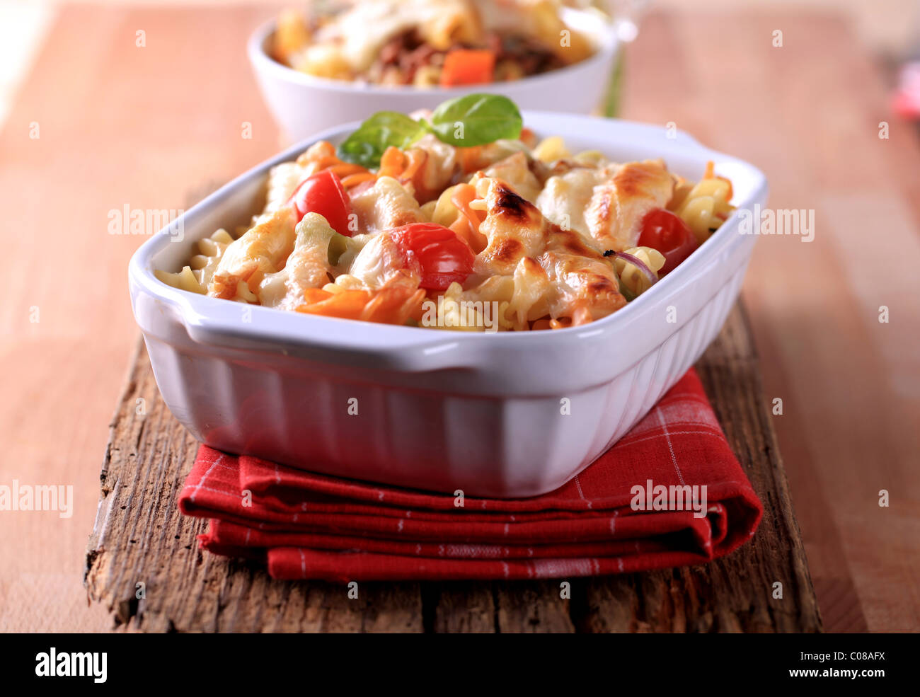Tricolor pasta with cherry tomatoes and cheese Stock Photo - Alamy