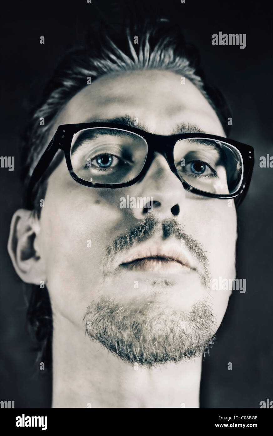 facial portrait of a young man in glasses Stock Photo - Alamy