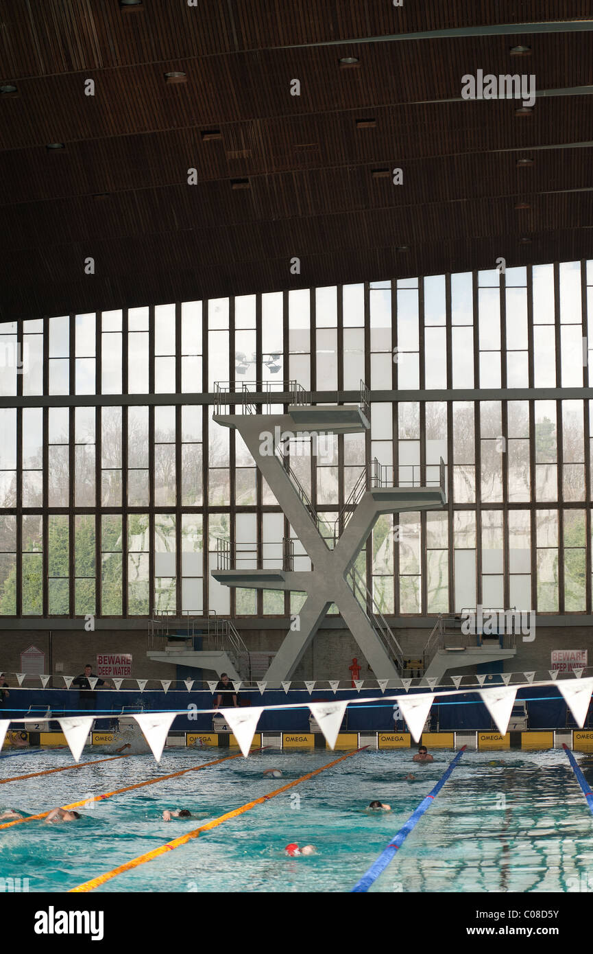 inside swimming pool competition with flags lane ropes diving platform ...