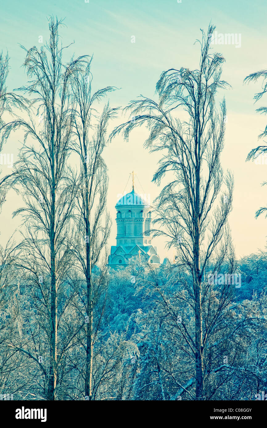 Beautiful winter landscape with forest covered snow and the Christian ...