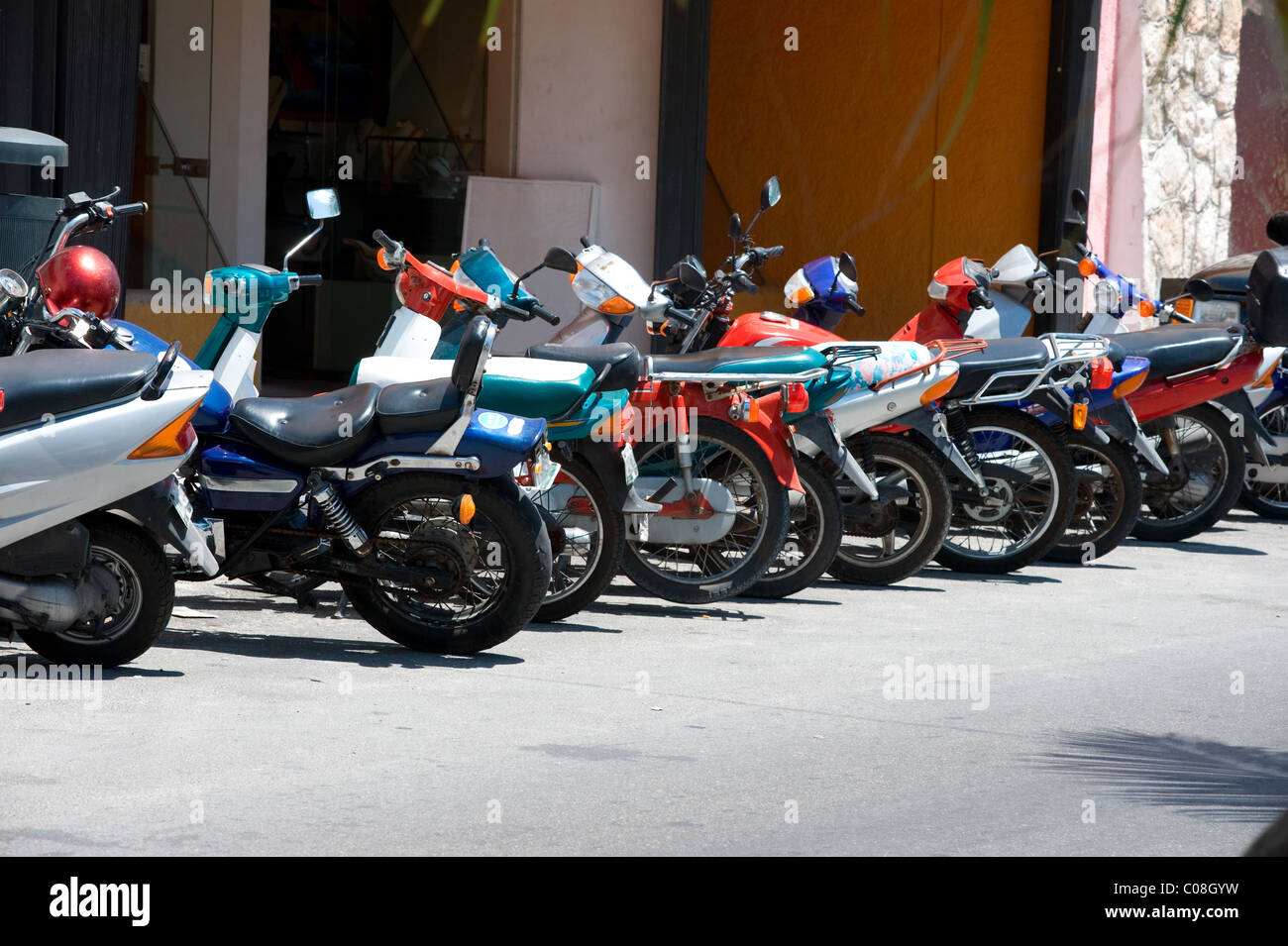 Motorcycles parked in a row in Cancun Mexico Stock Photo - Alamy