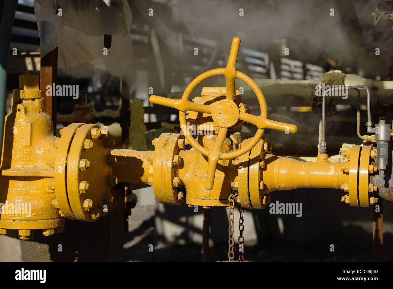 large yellow industrial valve Stock Photo - Alamy