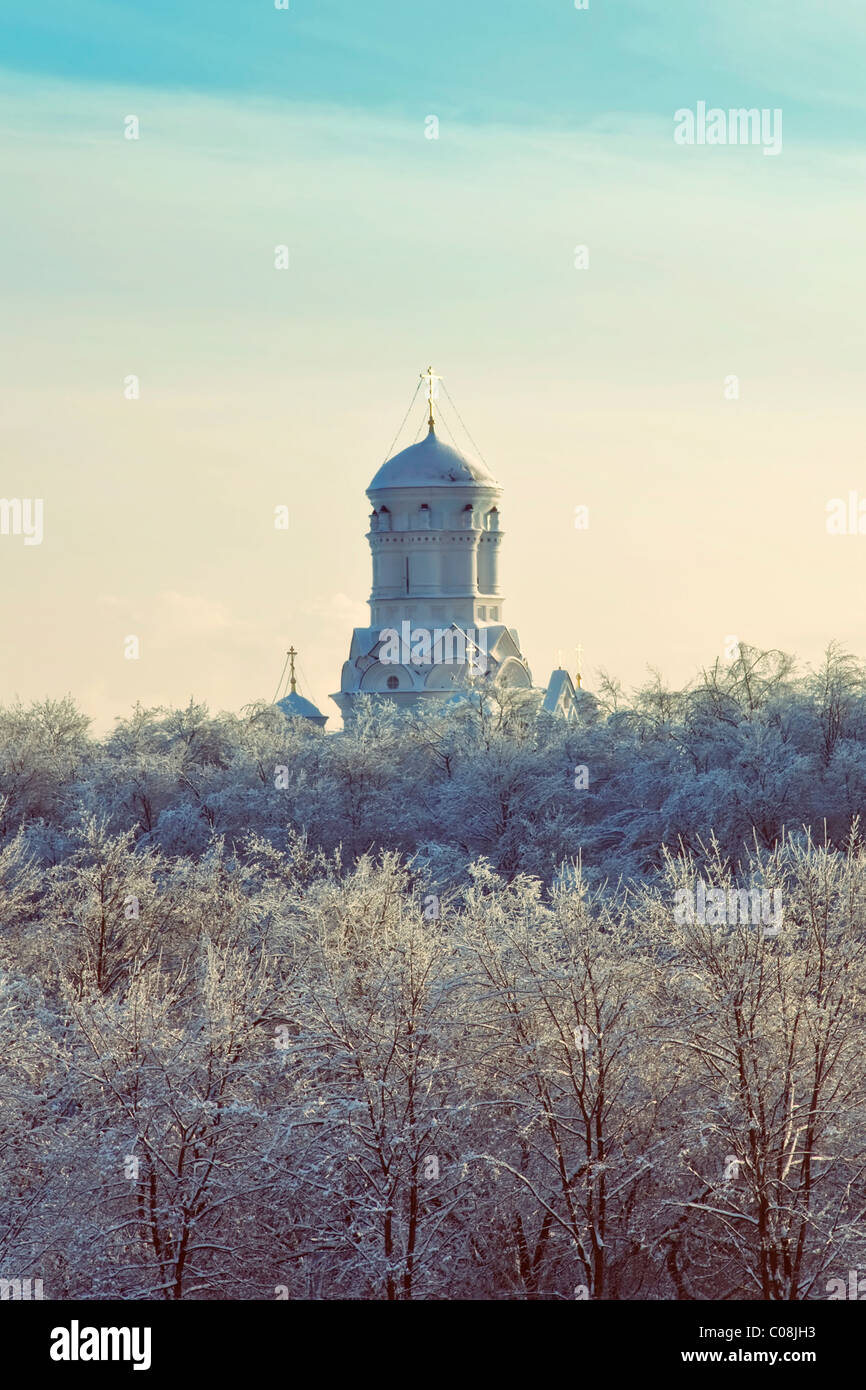 Beautiful winter landscape with forest covered snow and the Christian ...