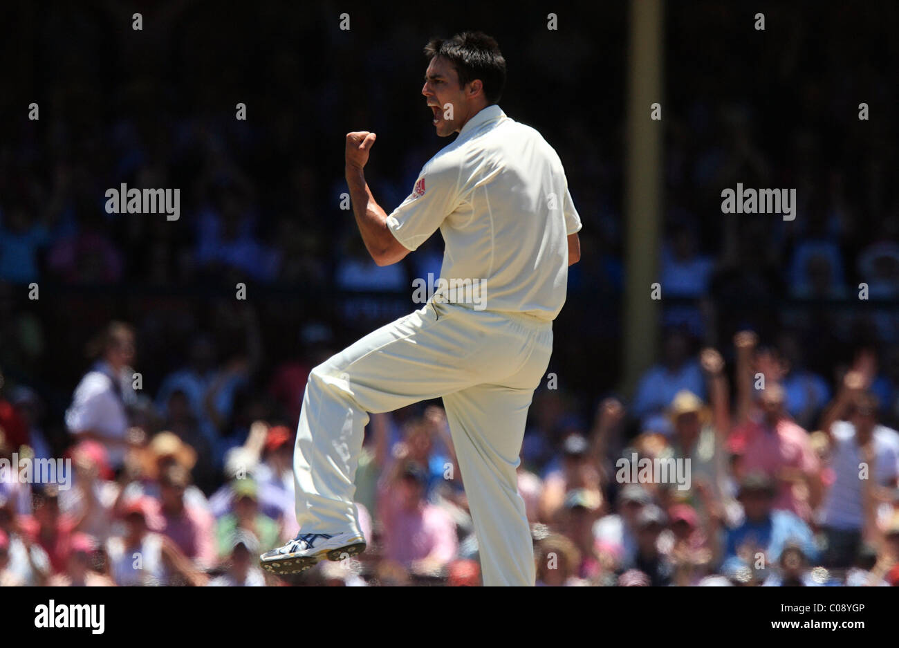 Australian bowler Mitchell Johnson celebrates after taking the wicket ...