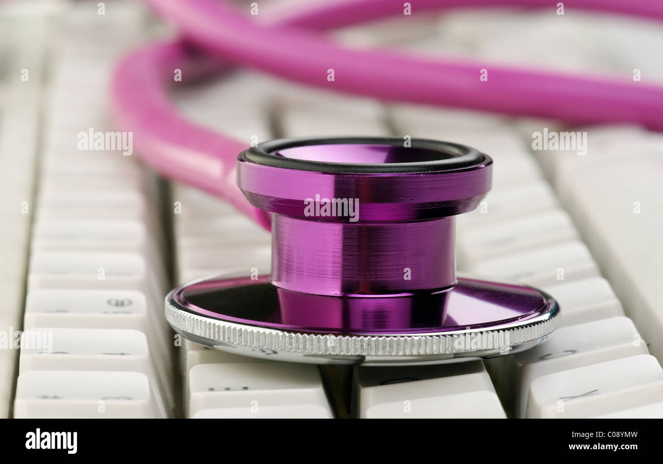 pink doctors stethoscope on white computer keyboard Stock Photo - Alamy