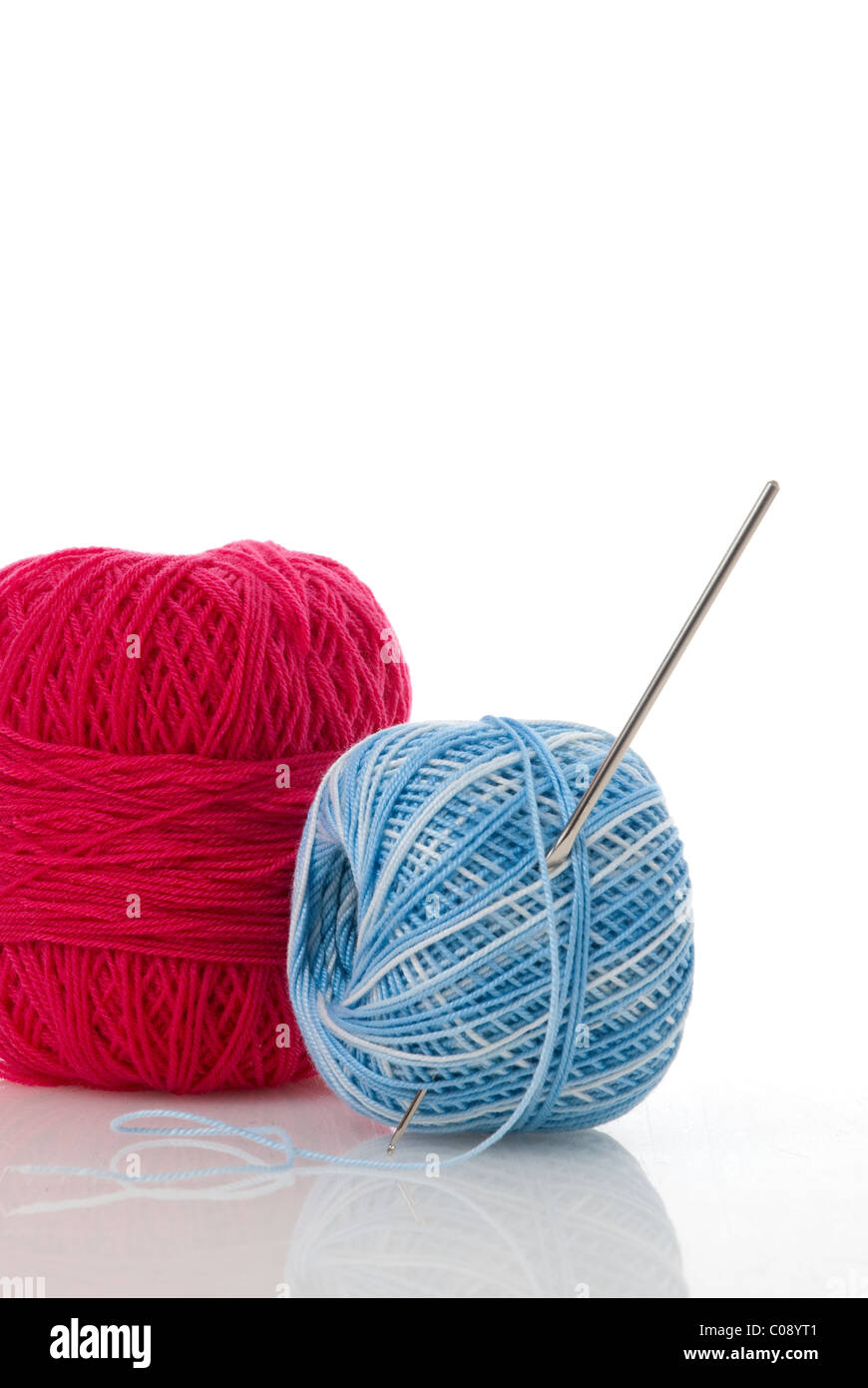 spools of two colors on a white background Stock Photo - Alamy