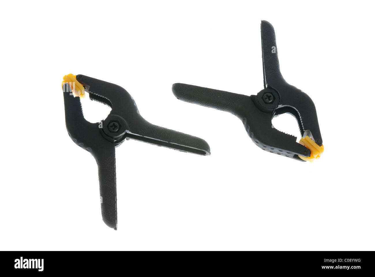 Yellow and black plastic clamps isolated on white background Stock ...