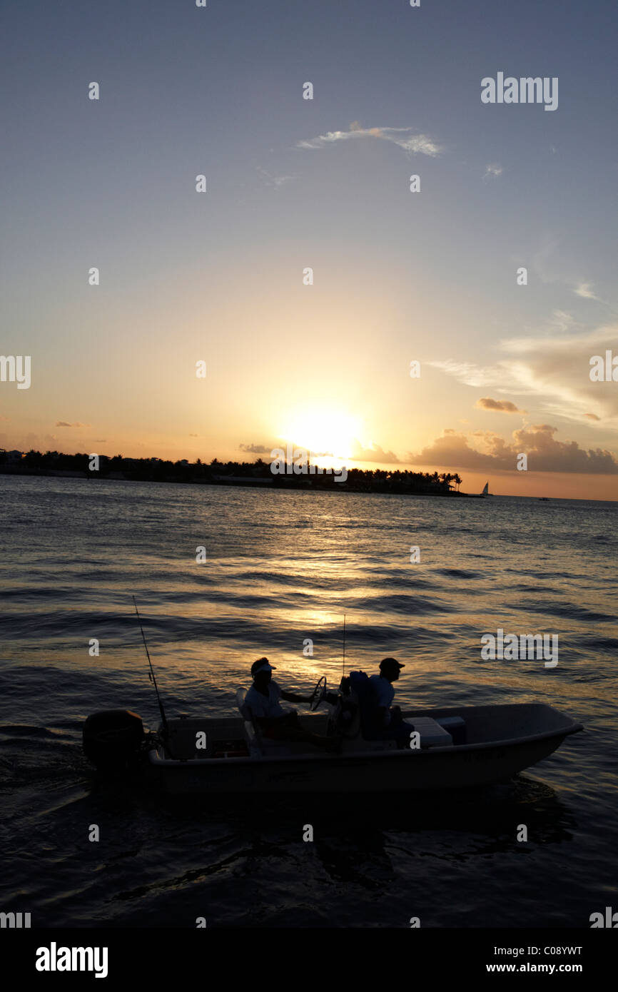 Boat at sunset Stock Photo - Alamy