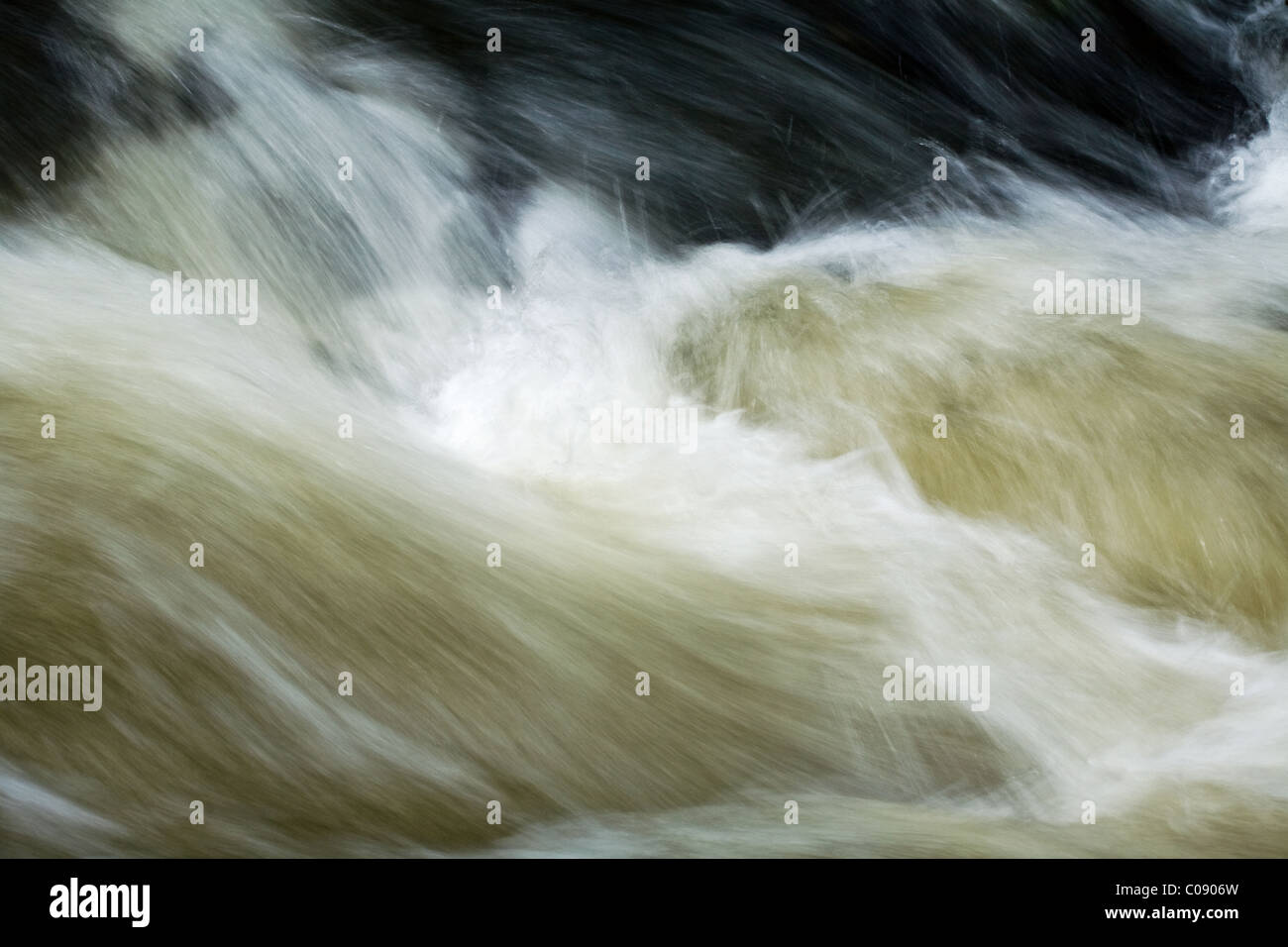 Abstract image of muddy fast-flowing water Stock Photo - Alamy