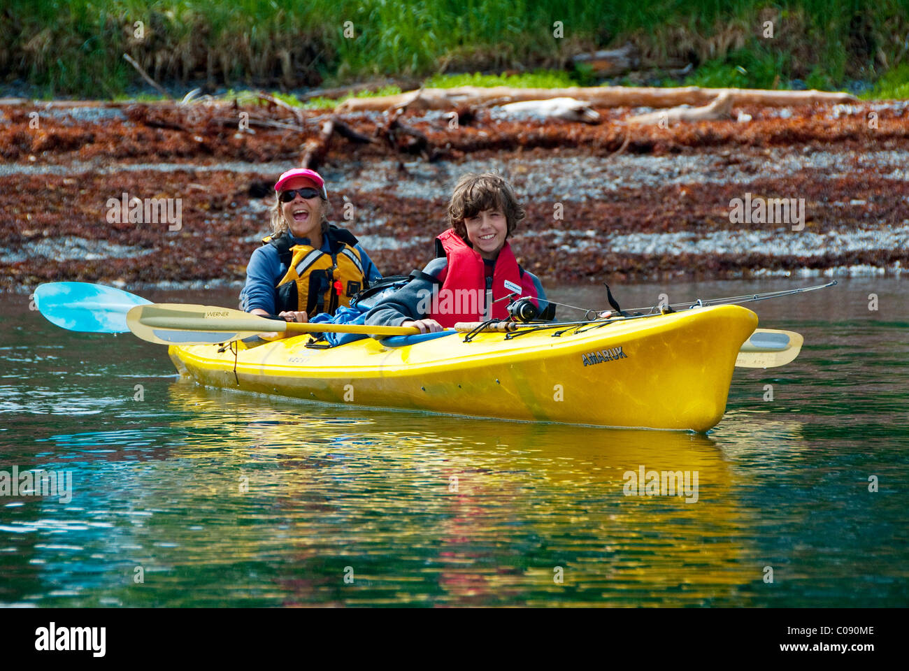 Mother and son sea kayaking and fishing in Prince William Sound ...
