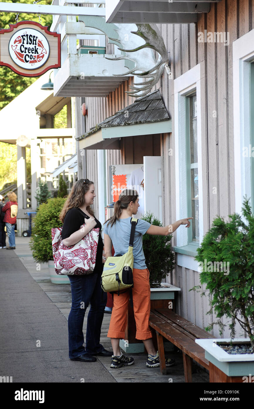 Two women shop along Creek Street in Ketchikan, Southeast Alaska ...