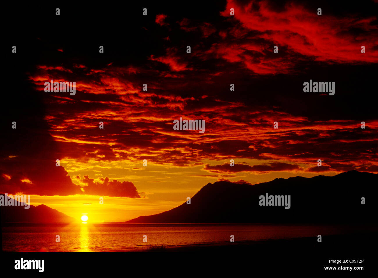 View of Turnagain Arm at sunset with Bird Point and Bird Ridge in the ...