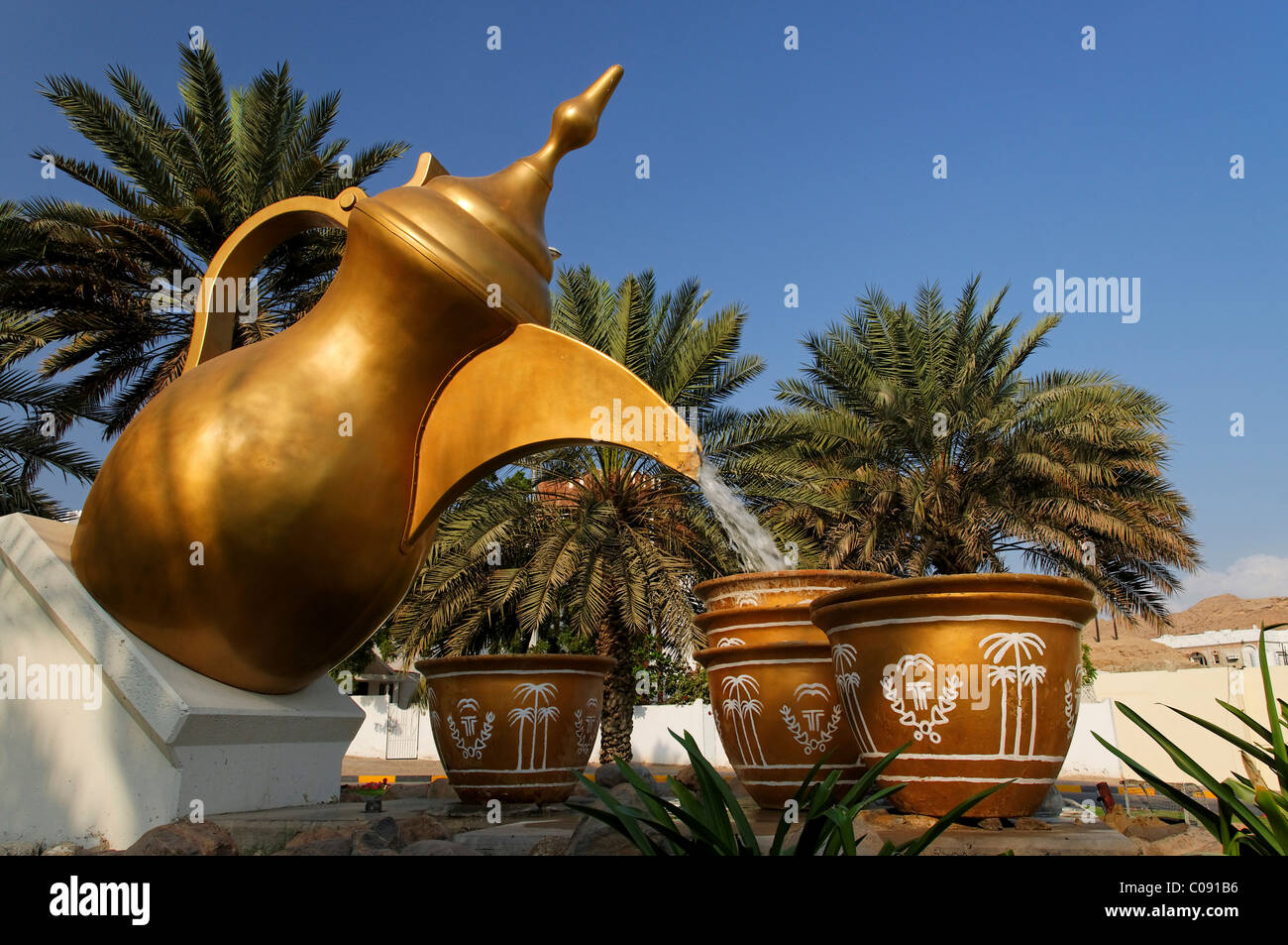 Oversize sculpture of a coffee pot with two cups, Capital Area, Oman ...
