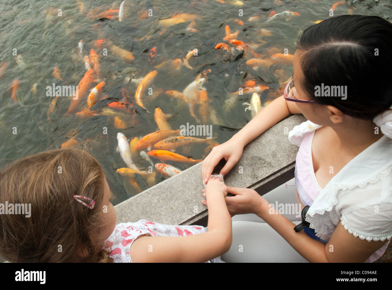 Koi fish chinese girl hi-res stock photography and images - Alamy