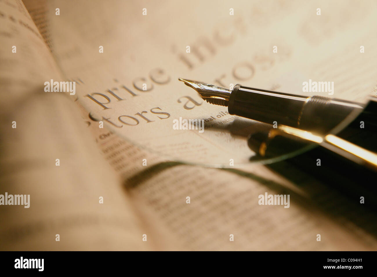 Fountain pen and newspaper Stock Photo - Alamy