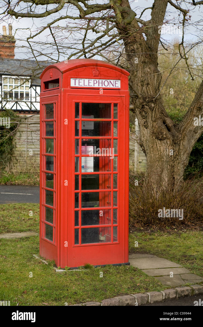 An original red telephone / coin operated phone / payphone / call box ...