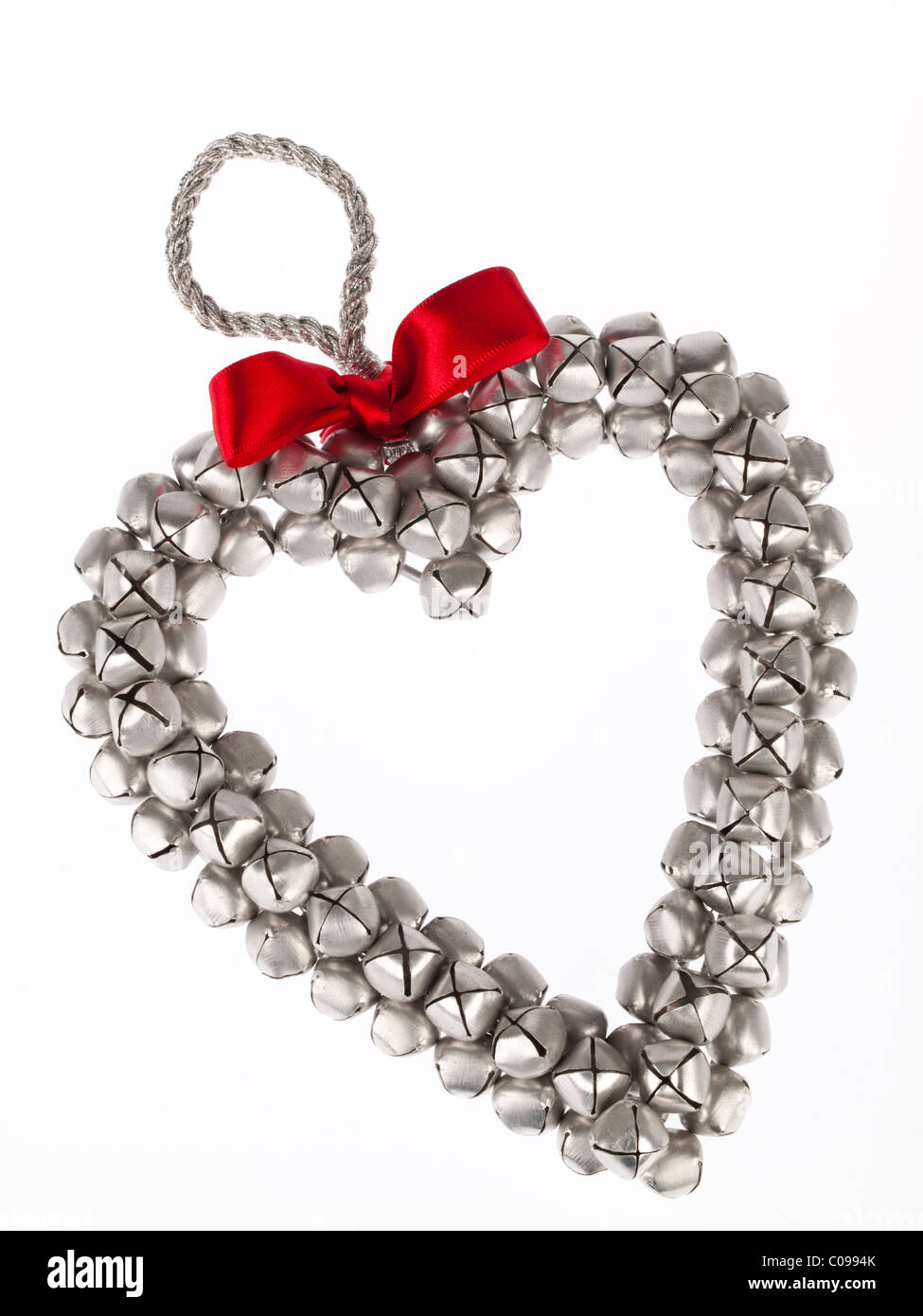 Heart shaped ring of bells with a small red bow on a white background ...