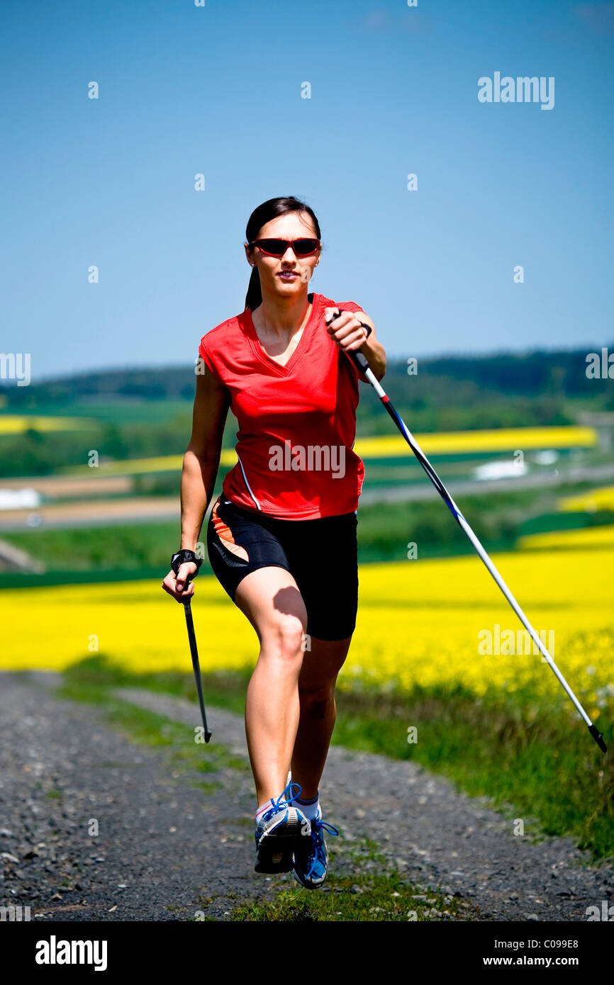 Young woman power walking Stock Photo - Alamy