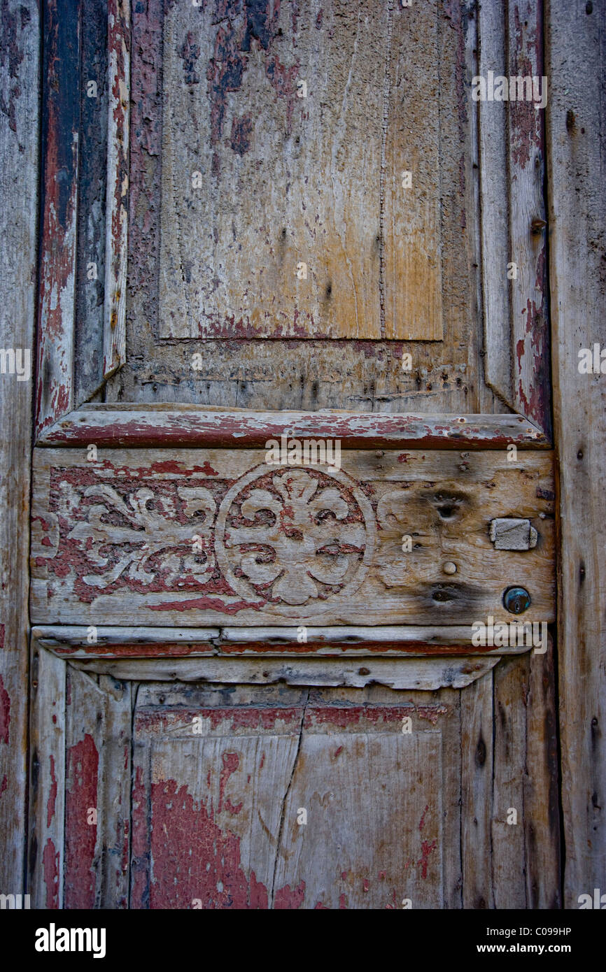 An old rustic period wooden front door with the paint peeling in Havana ...