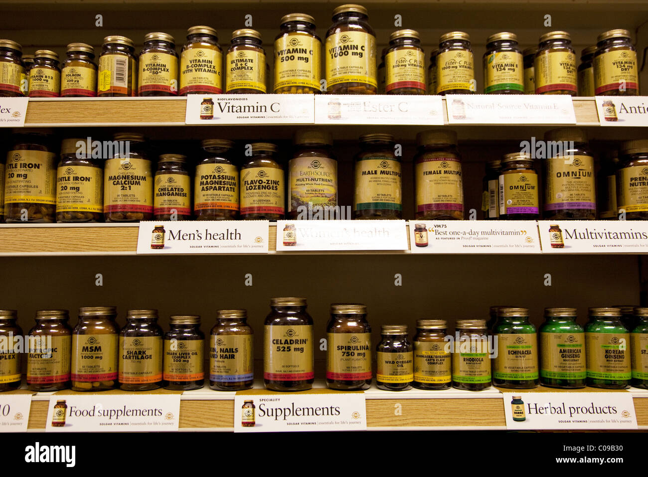 Bottles of health supplements displayed in London chemist's shop Stock ...