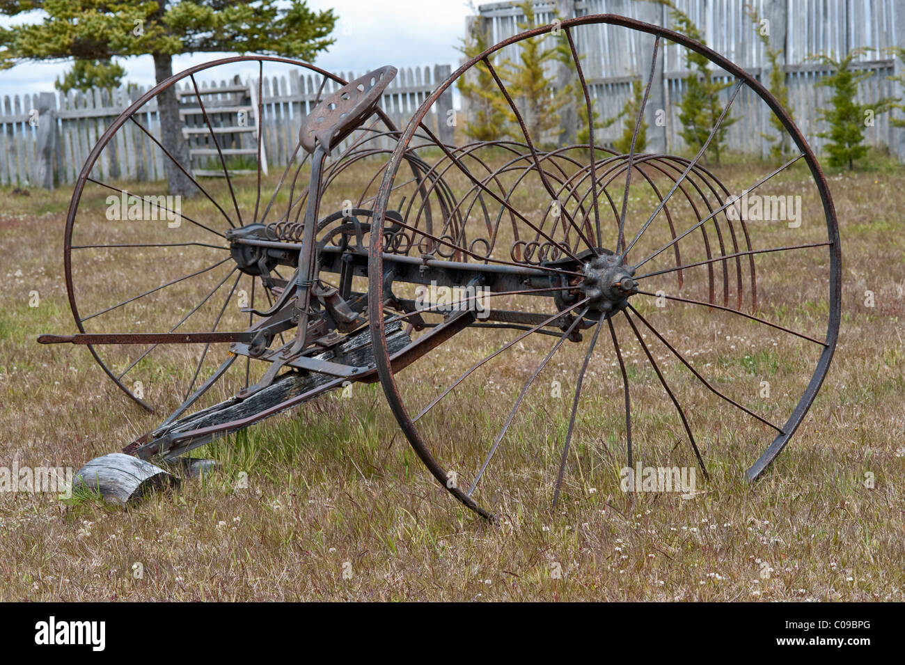 Rusty old-fashioned horse-drawn hay rake in Serro Negro Farm run by ...
