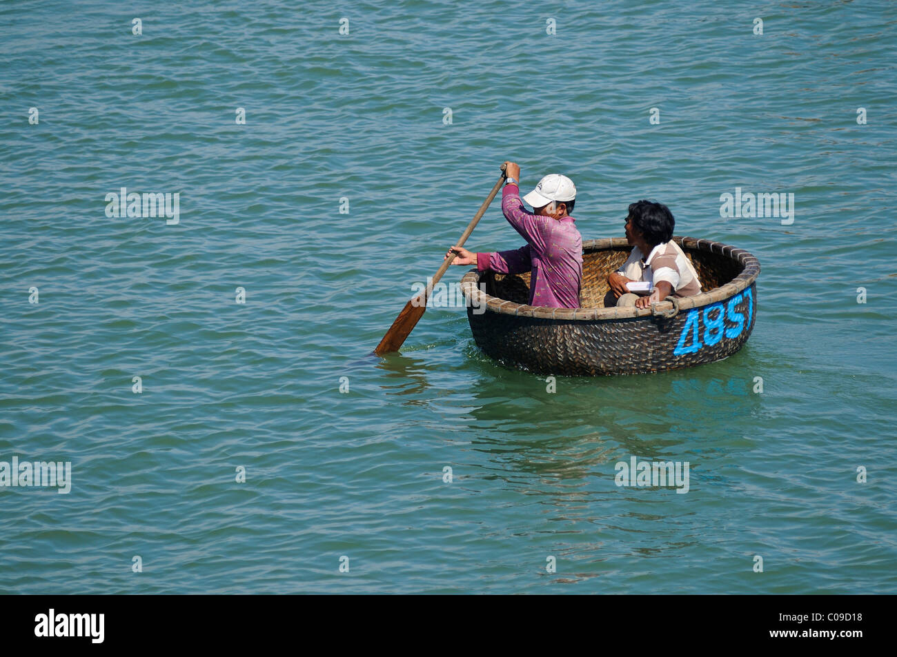 Traditional round wicker boat on the Cai river in the port, Nha Trang ...