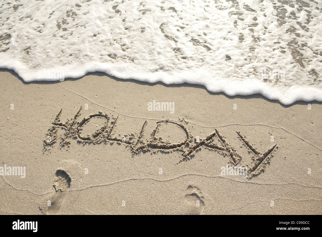 Holidays written in sand hi-res stock photography and images - Alamy