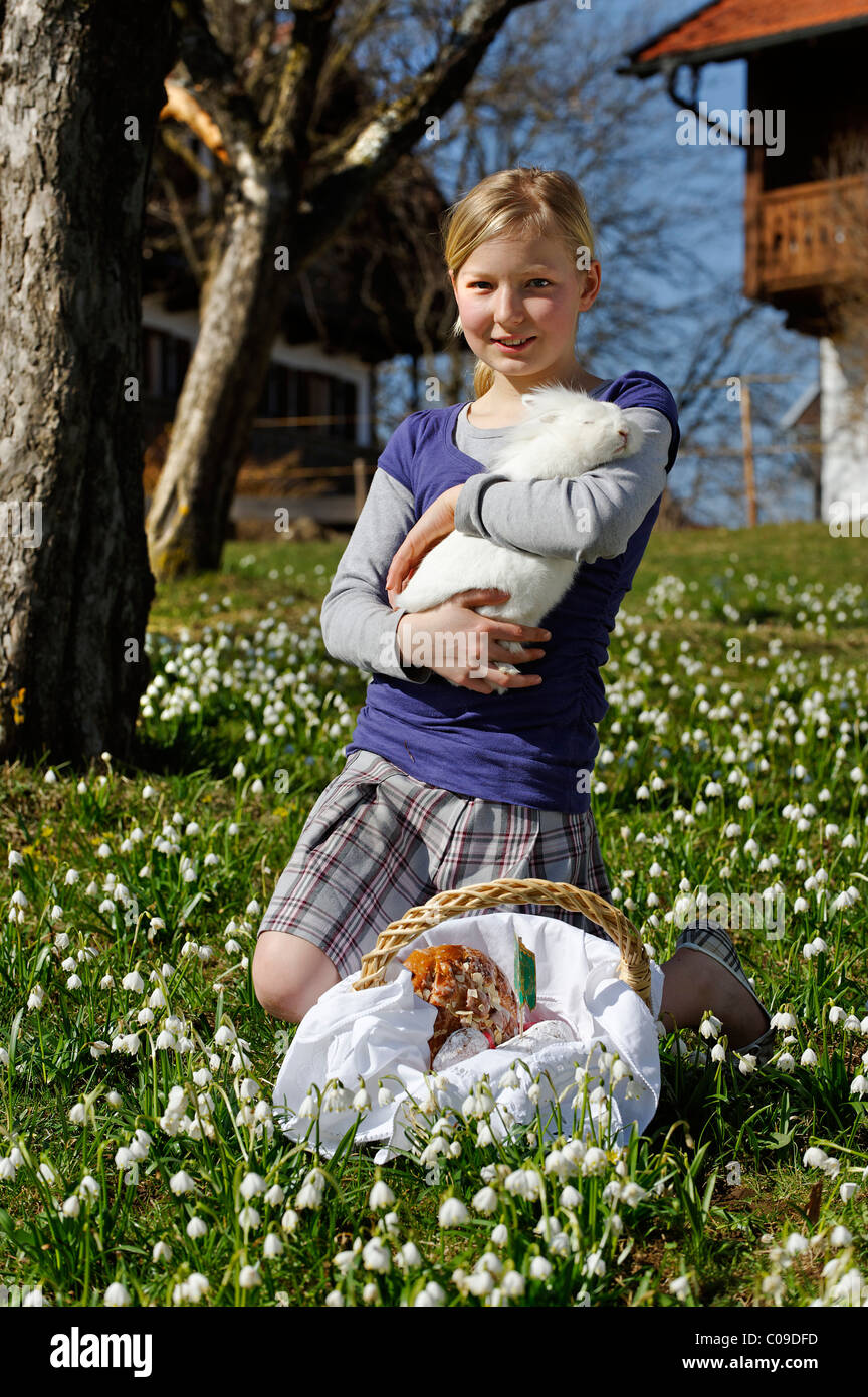 Girl holding rabbit in arms hi-res stock photography and images - Alamy