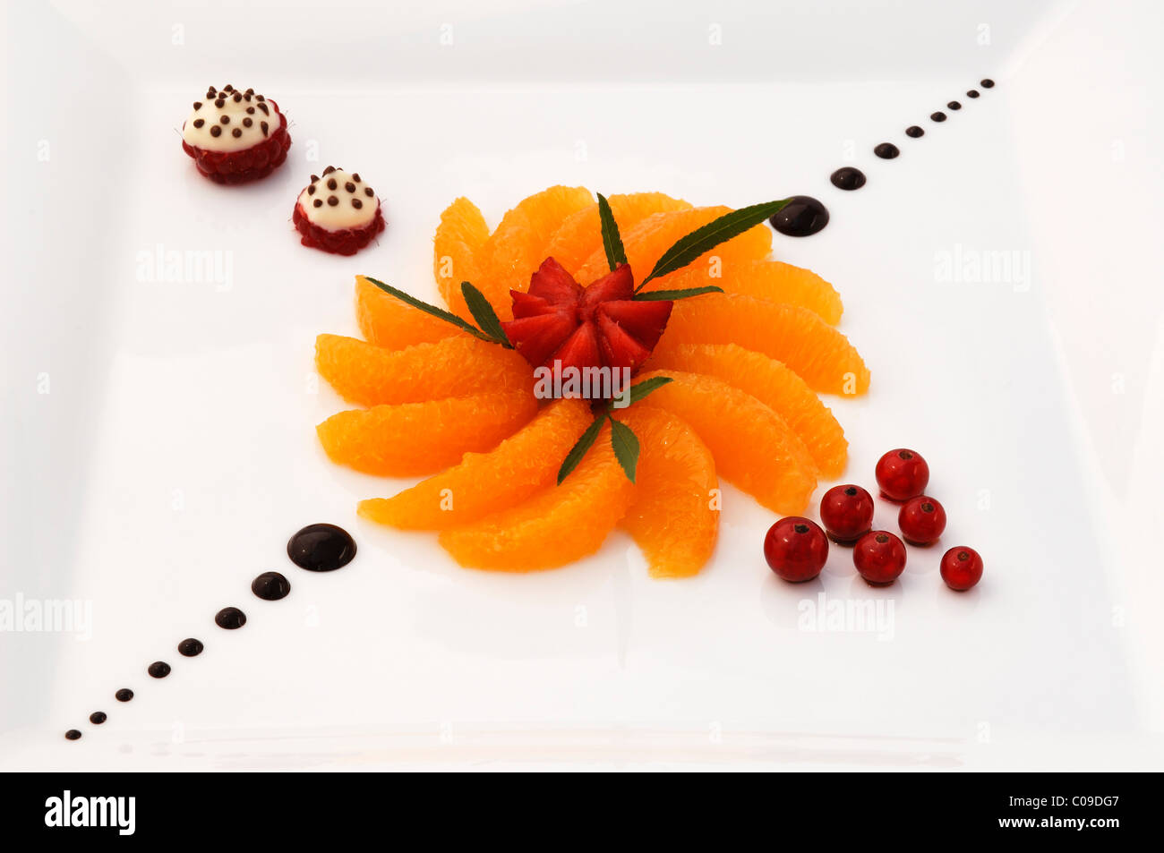 Dessert, fresh fruit platter served with various fruits on a white ...