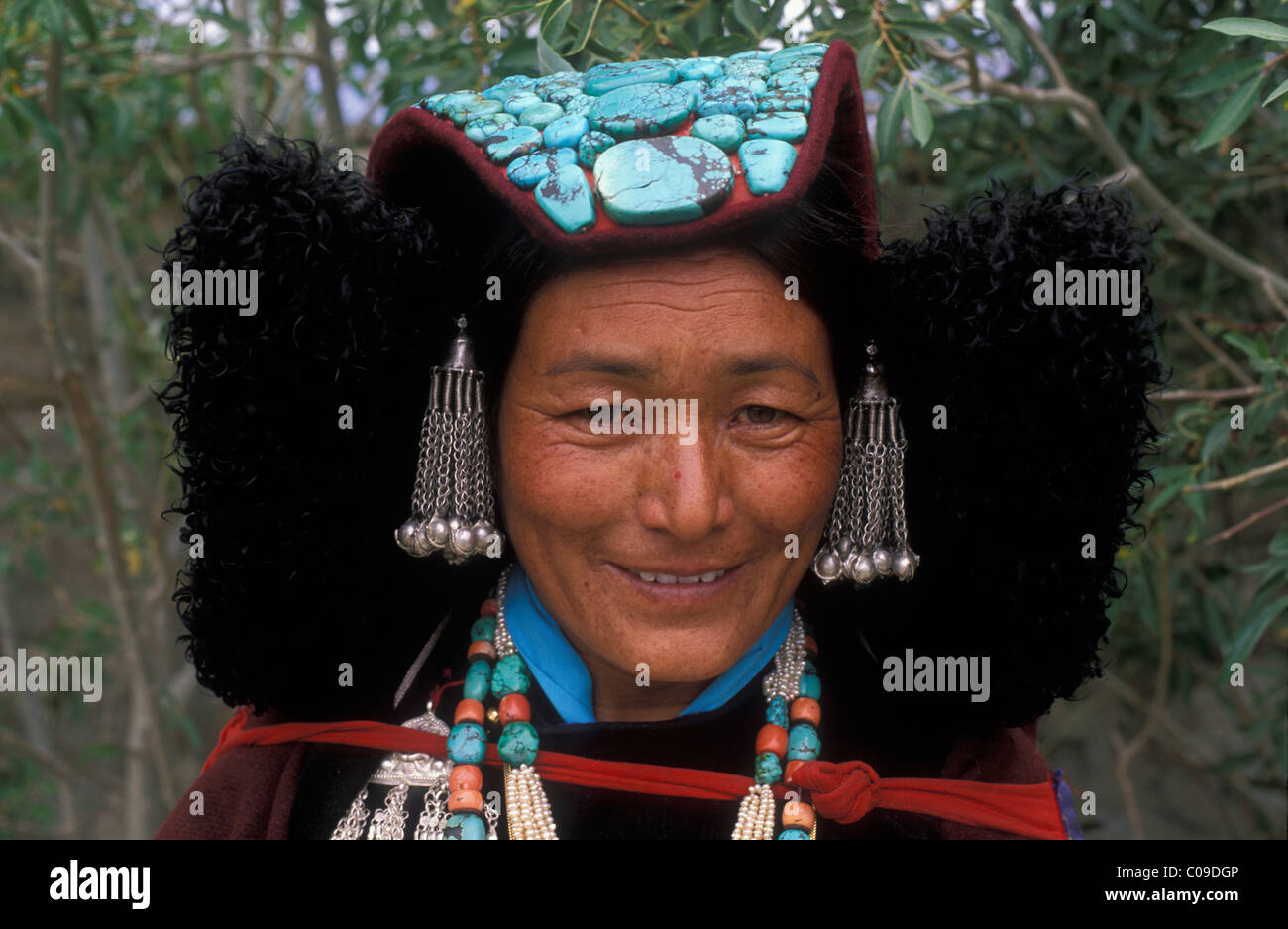 Portrait of a Woman wearing a traditional headdress with turquoises ...