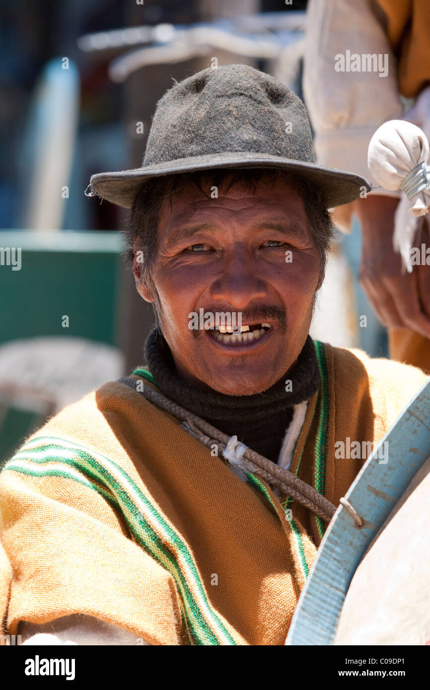 A peruvian man in costume for the parades of Puno Week 2010 in Peru ...