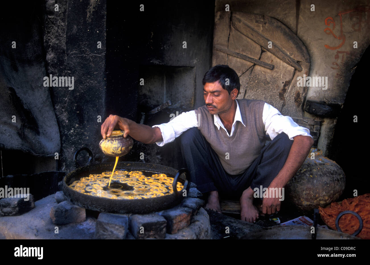 Oil baker preparing sweet pastries, Shekawati, Rajasthan, India, Asia ...