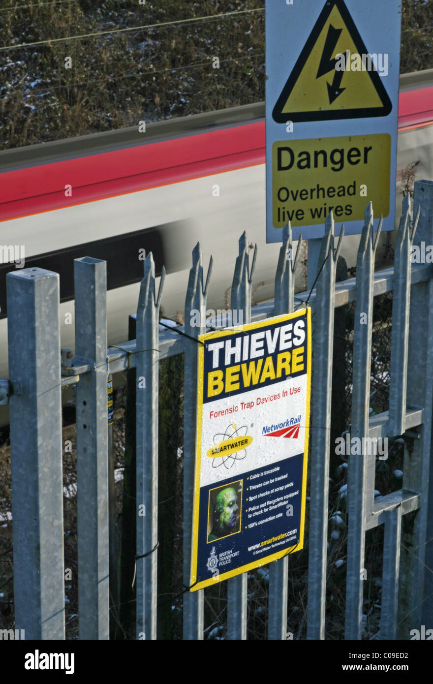 a sign next to a railway line saying thieves beware because of ...
